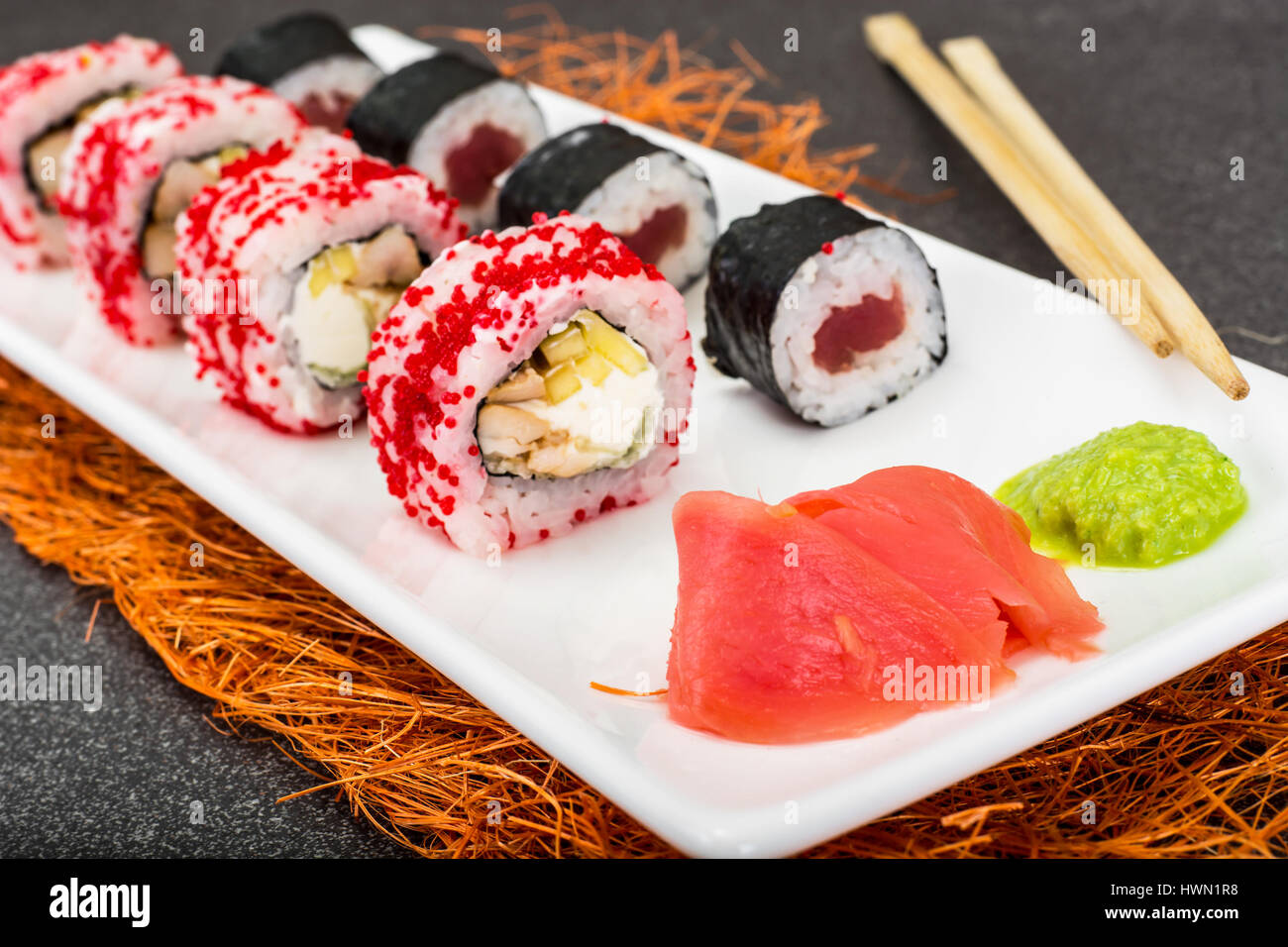 Various sushi rolls on white background Stock Photo - Alamy