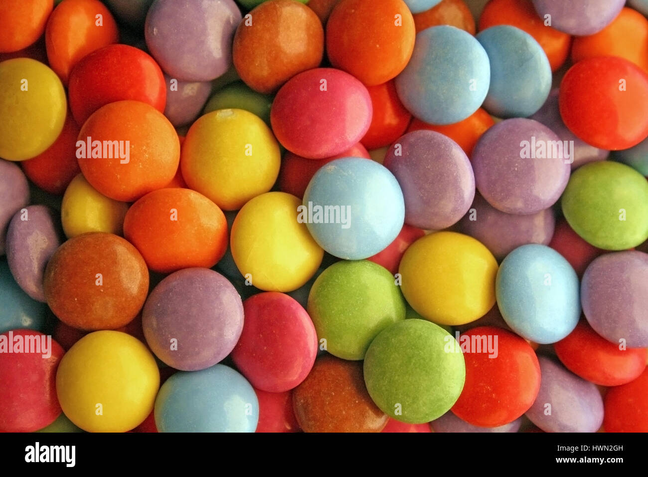 Colored candies background Stock Photo - Alamy