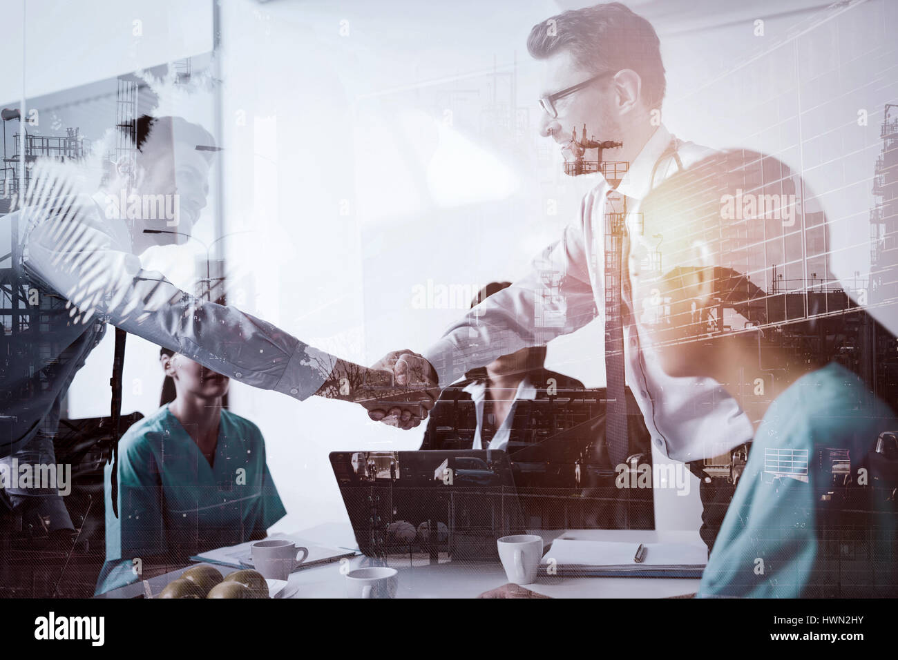 Image of factory against front side of buildings Stock Photo - Alamy