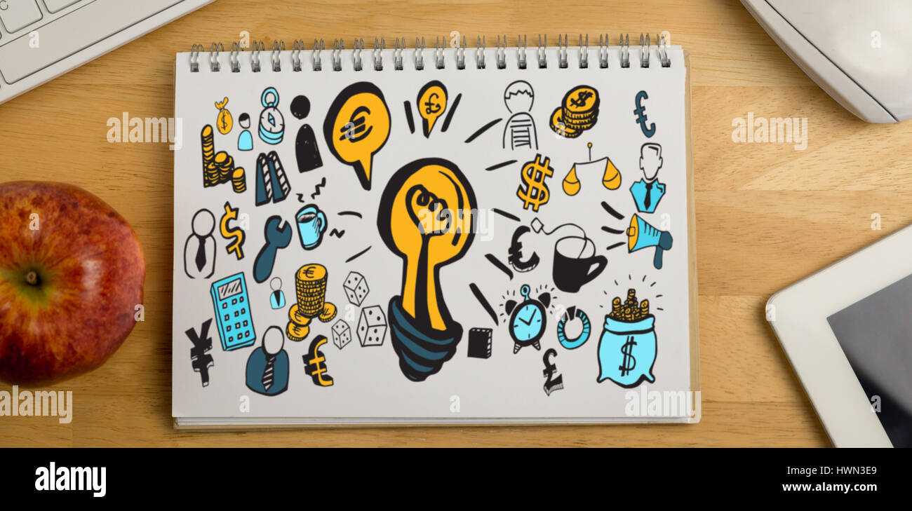 Composite image of different computer icons against overhead of notepad ...