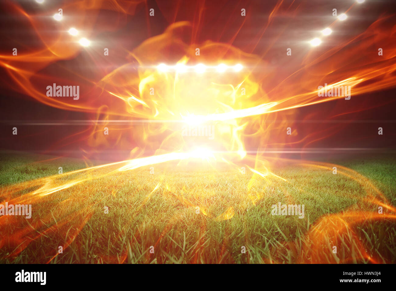 Ball of fire against football pitch with bright lights 3d Stock Photo ...