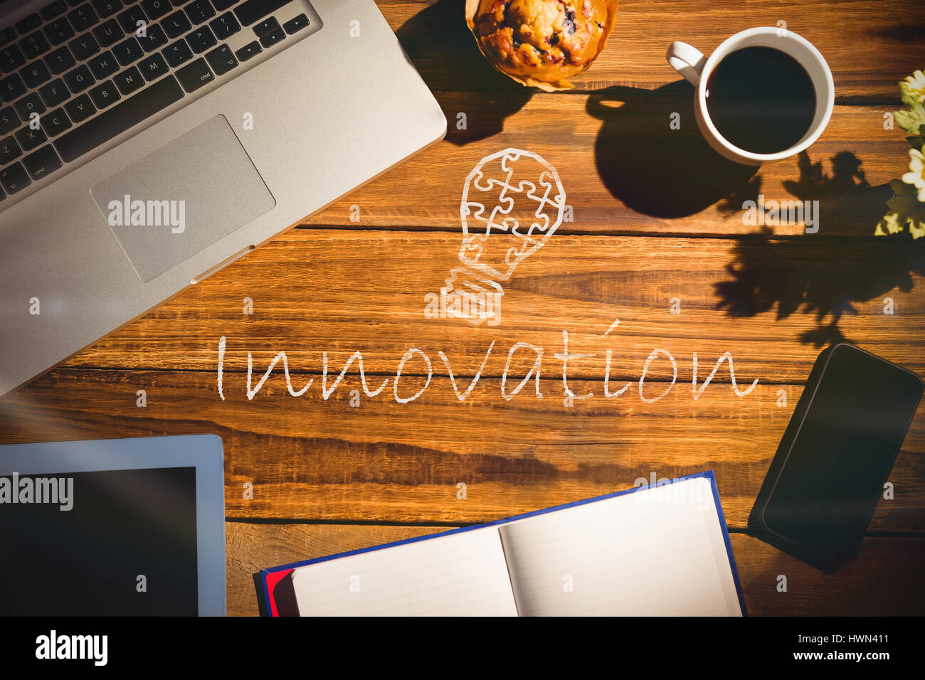 Idea and innovation graphic against overhead view of desk Stock Photo ...