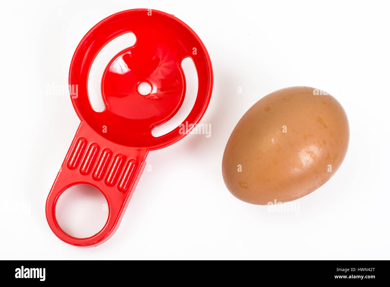 Broken eggs, separation of yolk Stock Photo - Alamy