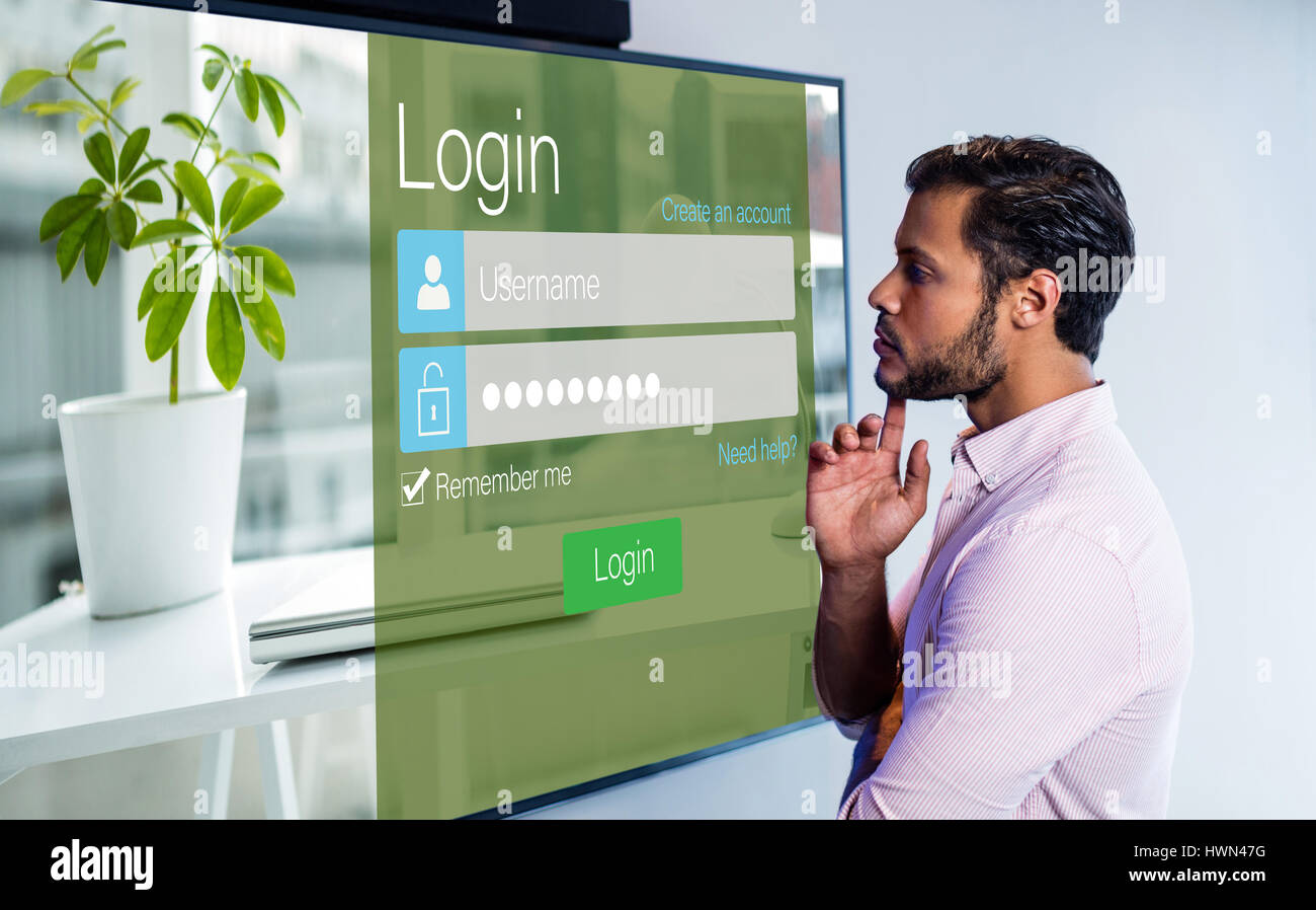 Close-up of login page against thoughtful man looking over whiteboard ...