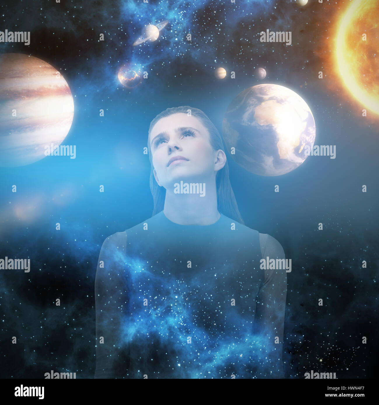 Sad woman looking up against graphic image of various planets with sun ...