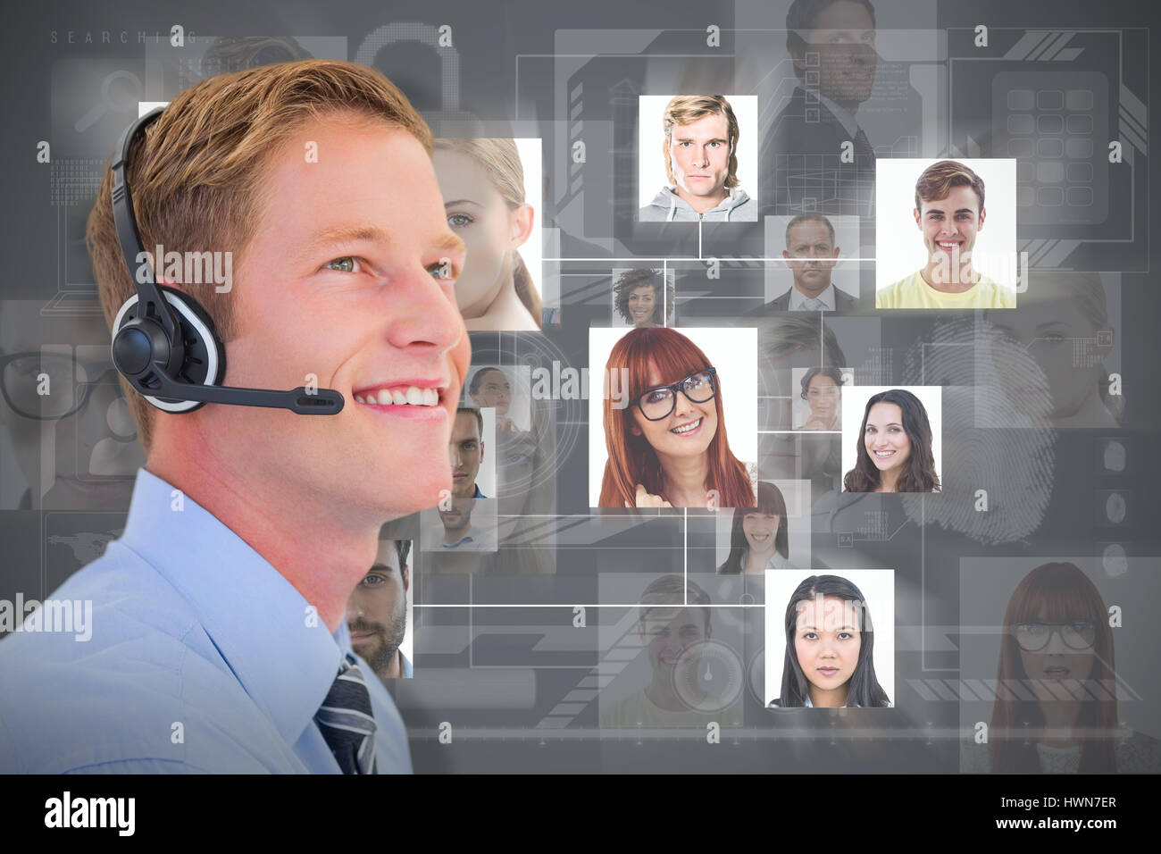 Handsome agent with headset against dark grey background Stock Photo ...