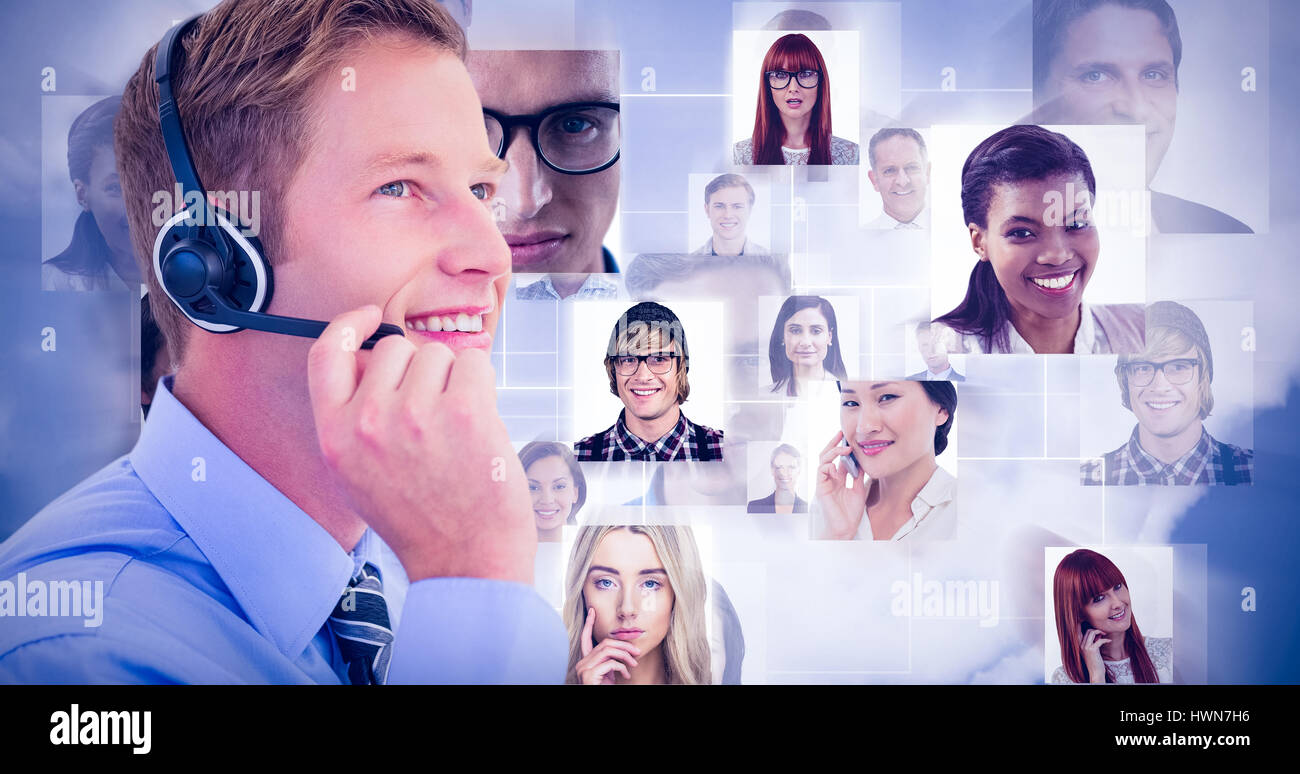 Handsome agent with headset against grey background Stock Photo - Alamy