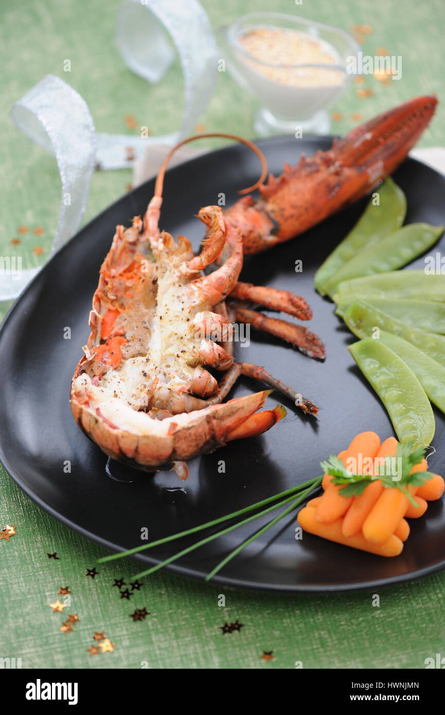 Homard rôti au four au beurre salé Stock Photo - Alamy