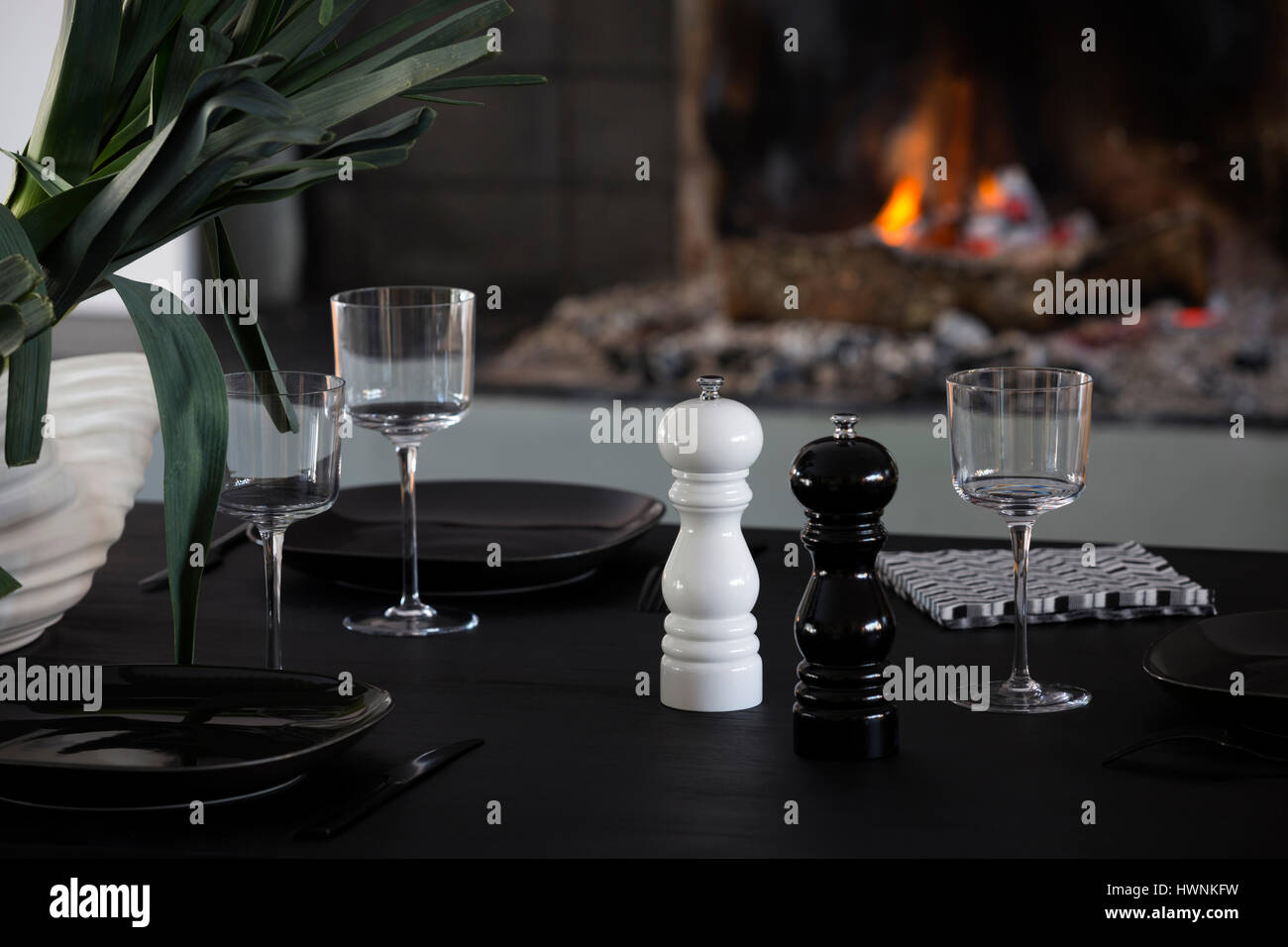 A laid out contemporary table - made out of a charred wood according to ...