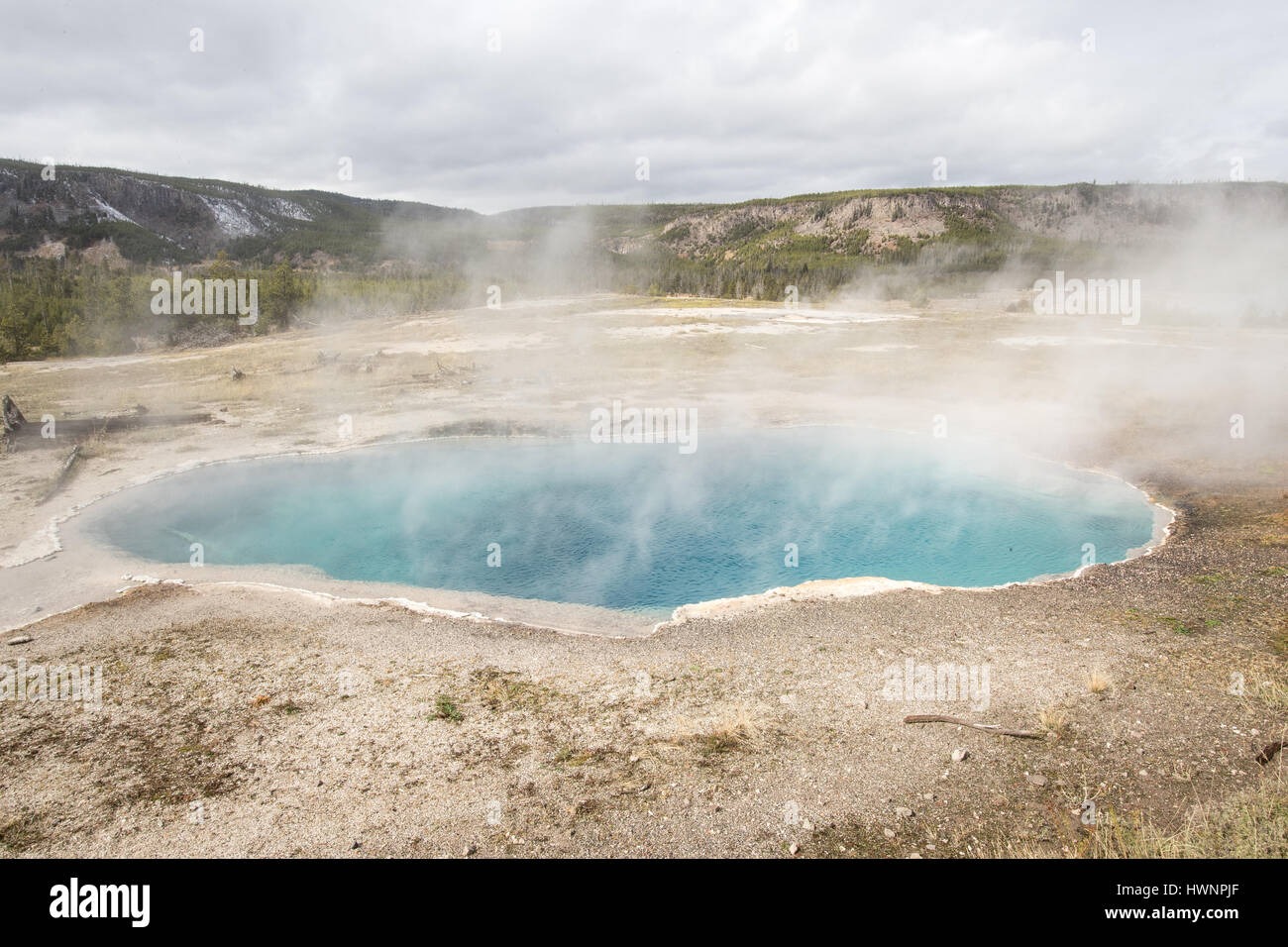 Steam rises from the Gem Pool in the Upper Geyser Basin at Yellowstone ...