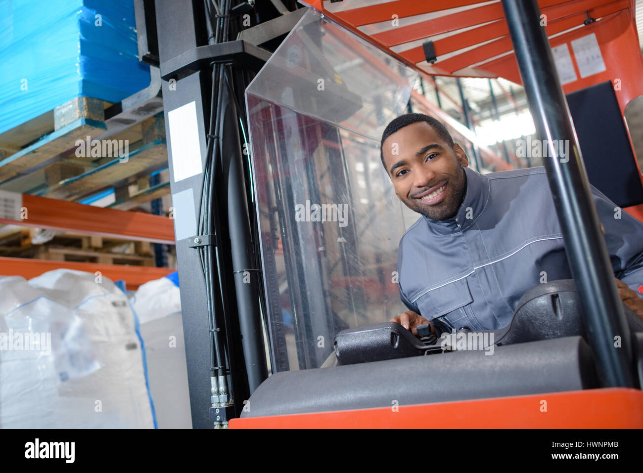 Portrait of man in forklift Stock Photo - Alamy