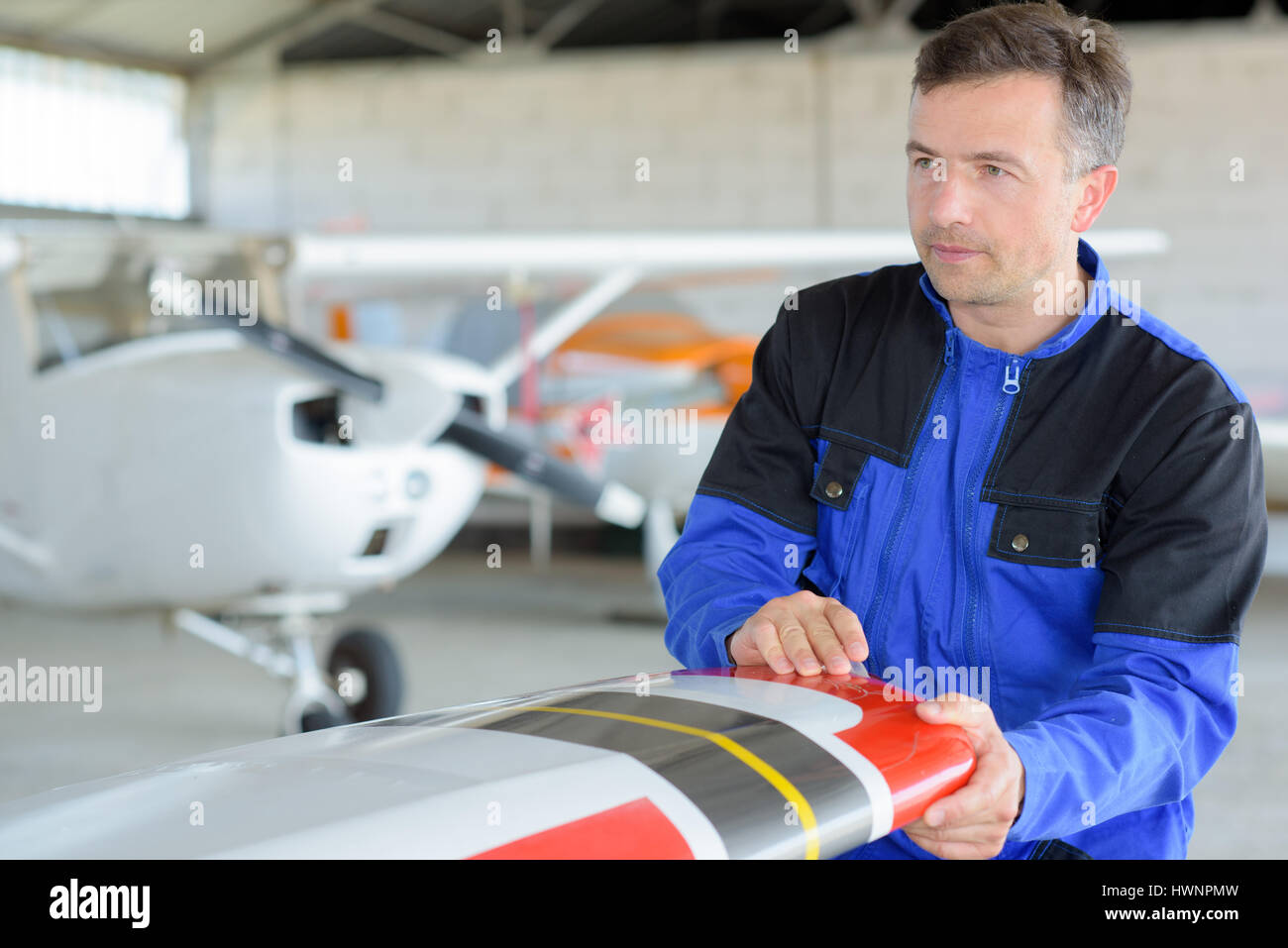 fixing a plane Stock Photo - Alamy