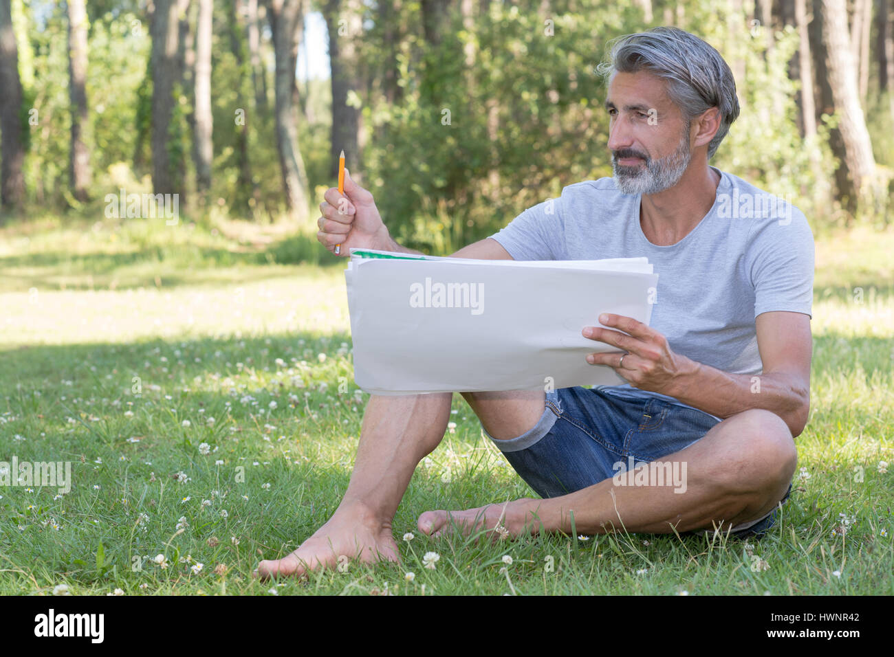handsome man painting a spring landscape Stock Photo - Alamy