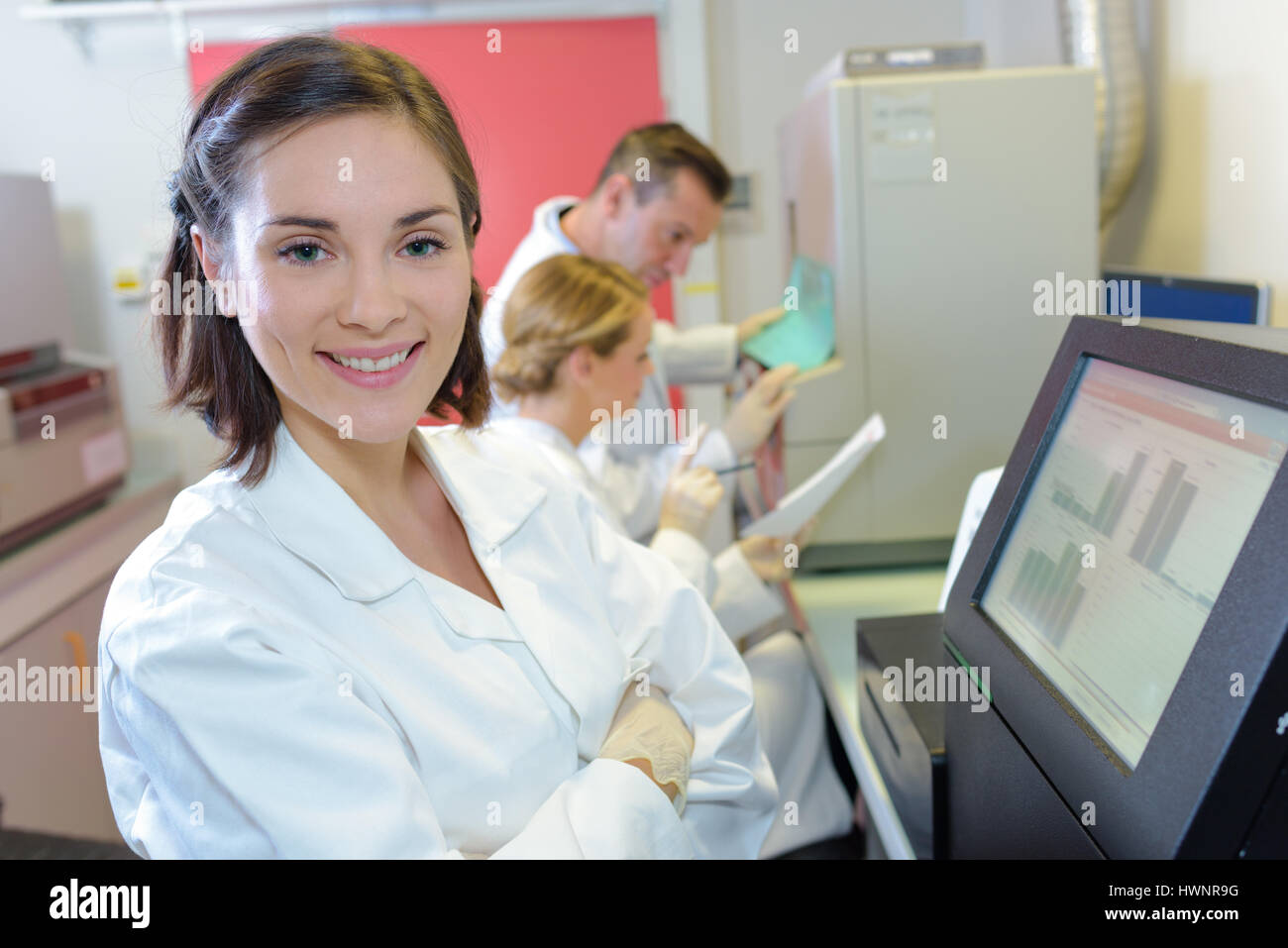 medical scientists using digital machinery at laboratory Stock Photo ...