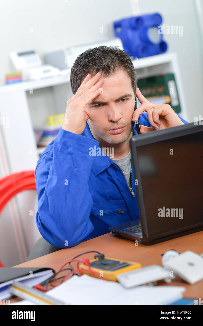 Craftsman working with his computer Stock Photo - Alamy