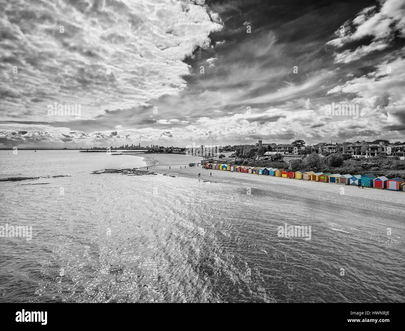 Black and white aerial view of Brighton Beach bathing huts on a bright ...