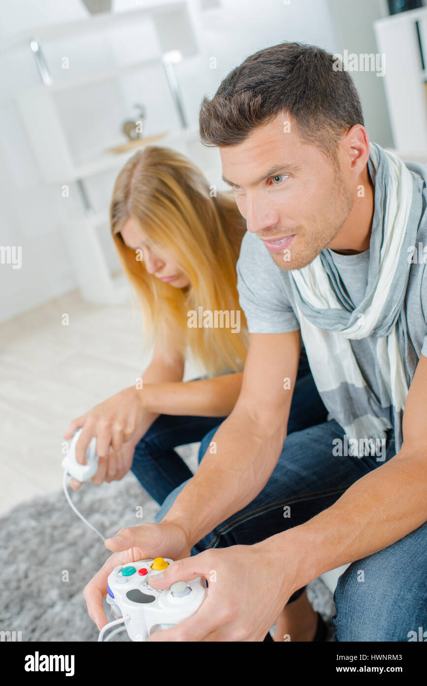 Couple at home playing computer game Stock Photo - Alamy