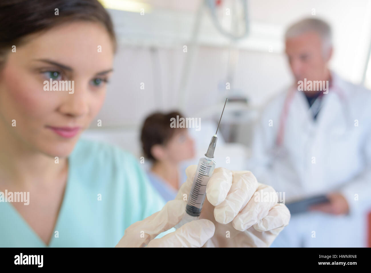 Closeup of nurse preparing syringe Stock Photo - Alamy