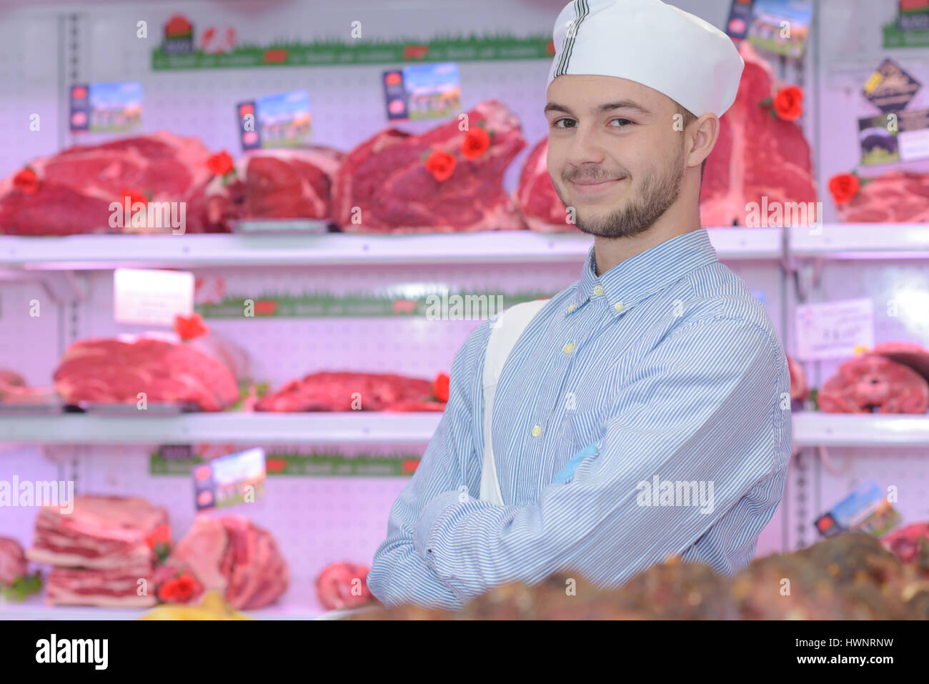 young butcher posing Stock Photo - Alamy