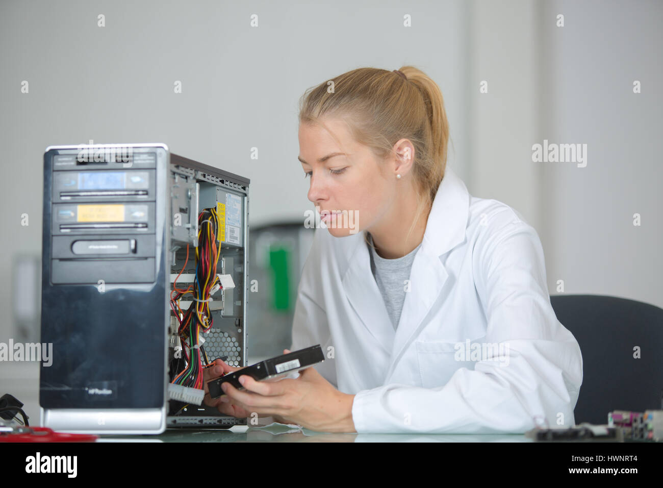 Woman repairing computer part hi-res stock photography and images - Alamy