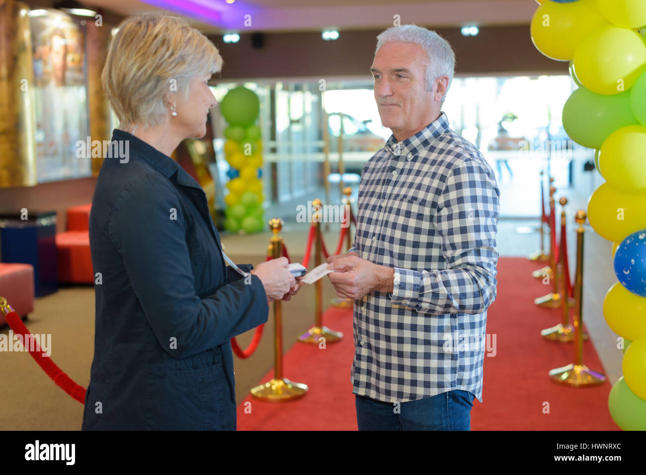 man giving an entrance ticket Stock Photo - Alamy