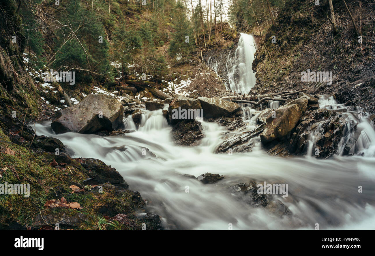 rocky Waterfall in spring forest Stock Photo - Alamy