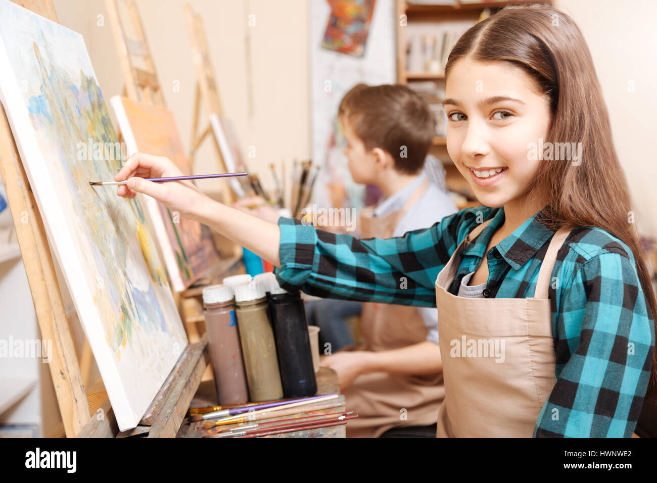Young gifted generation painting. Energetic ambitious young girl ...