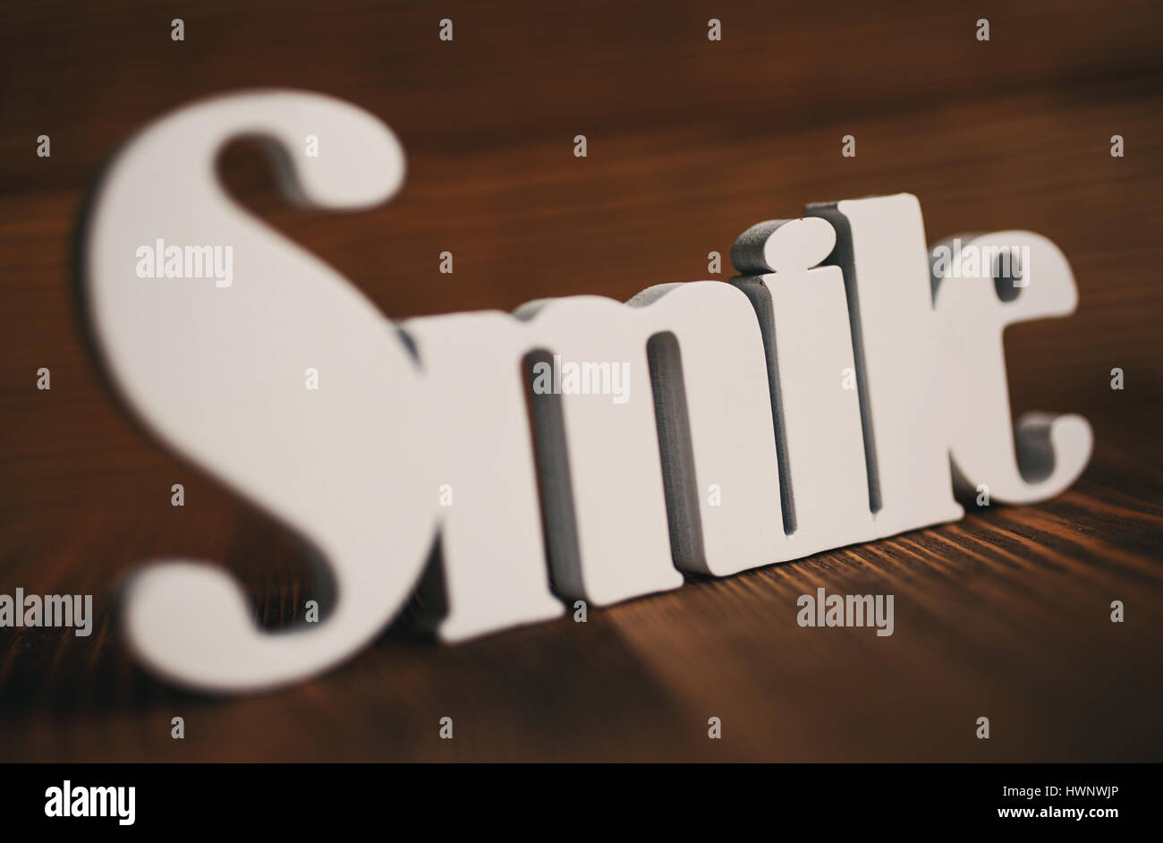 smile letters on wooden background Stock Photo - Alamy