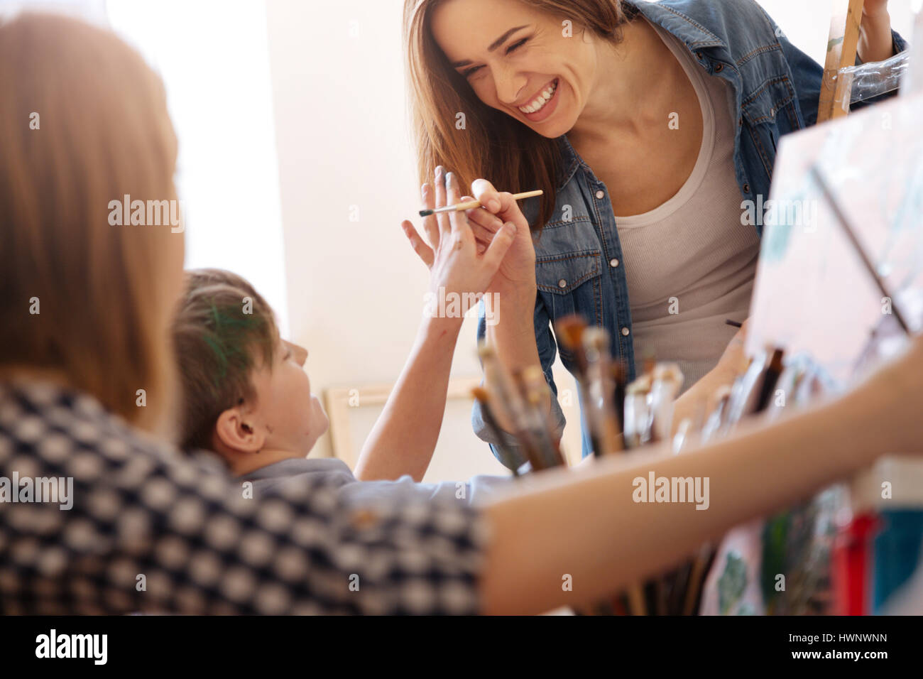 Sharing positive emotions. Optimistic cheerful playful teacher standing ...