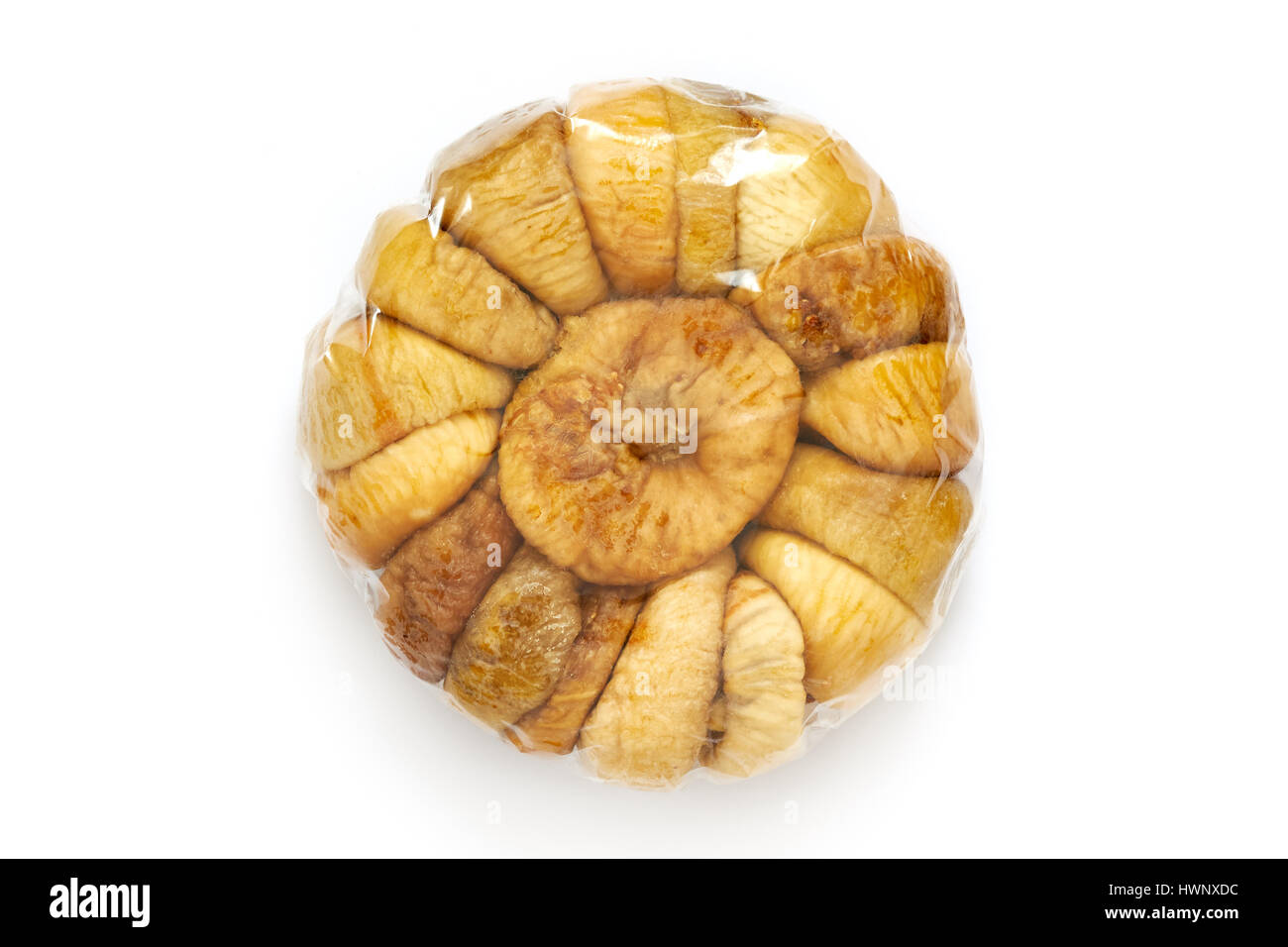 Dried figs in round plastic packaging isolated on white background. Top ...