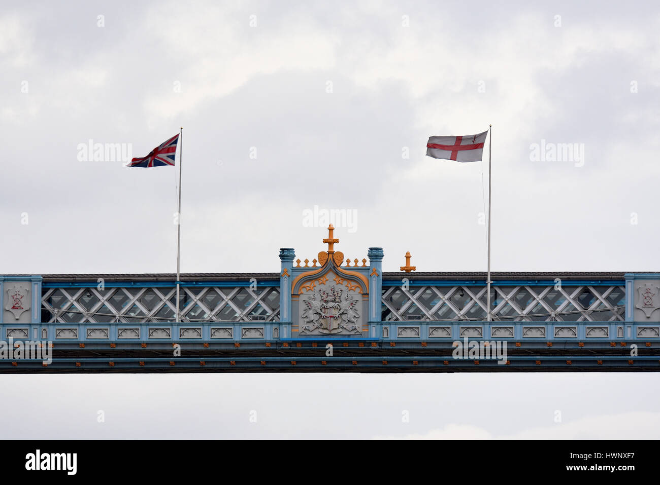 The centre of the walkway of Tower Bridge, London, with flags and ...