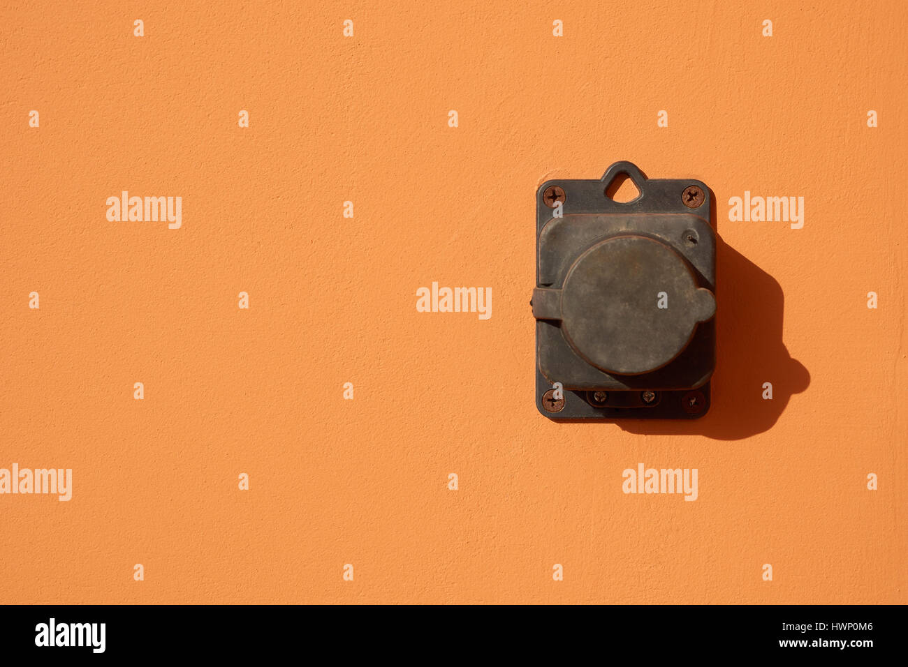 External power outlet on beige wall outdoors Stock Photo - Alamy