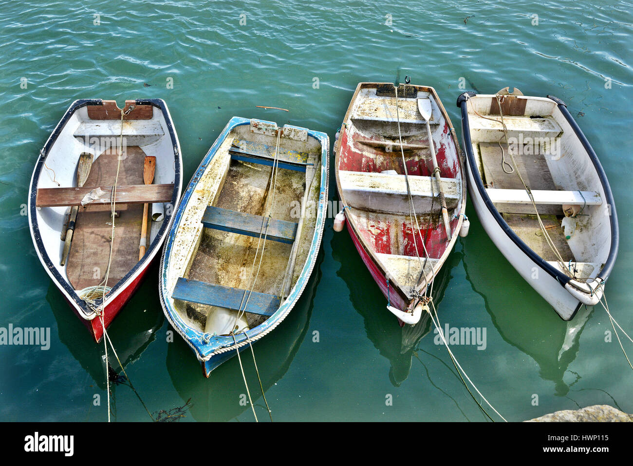 Four Moored Boats In Porthleven Harbour, Cornwall Stock Photo - Alamy