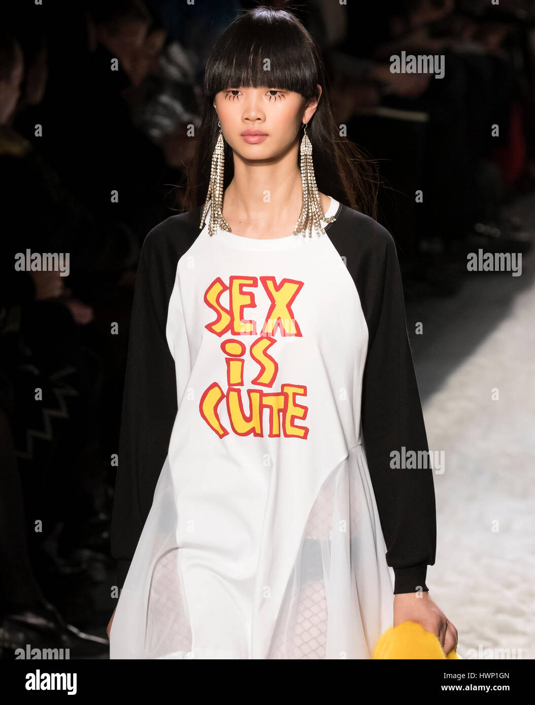 NEW YORK, NY - FEBRUARY 10, 2017: Huan Zhou walks the runway at the ...