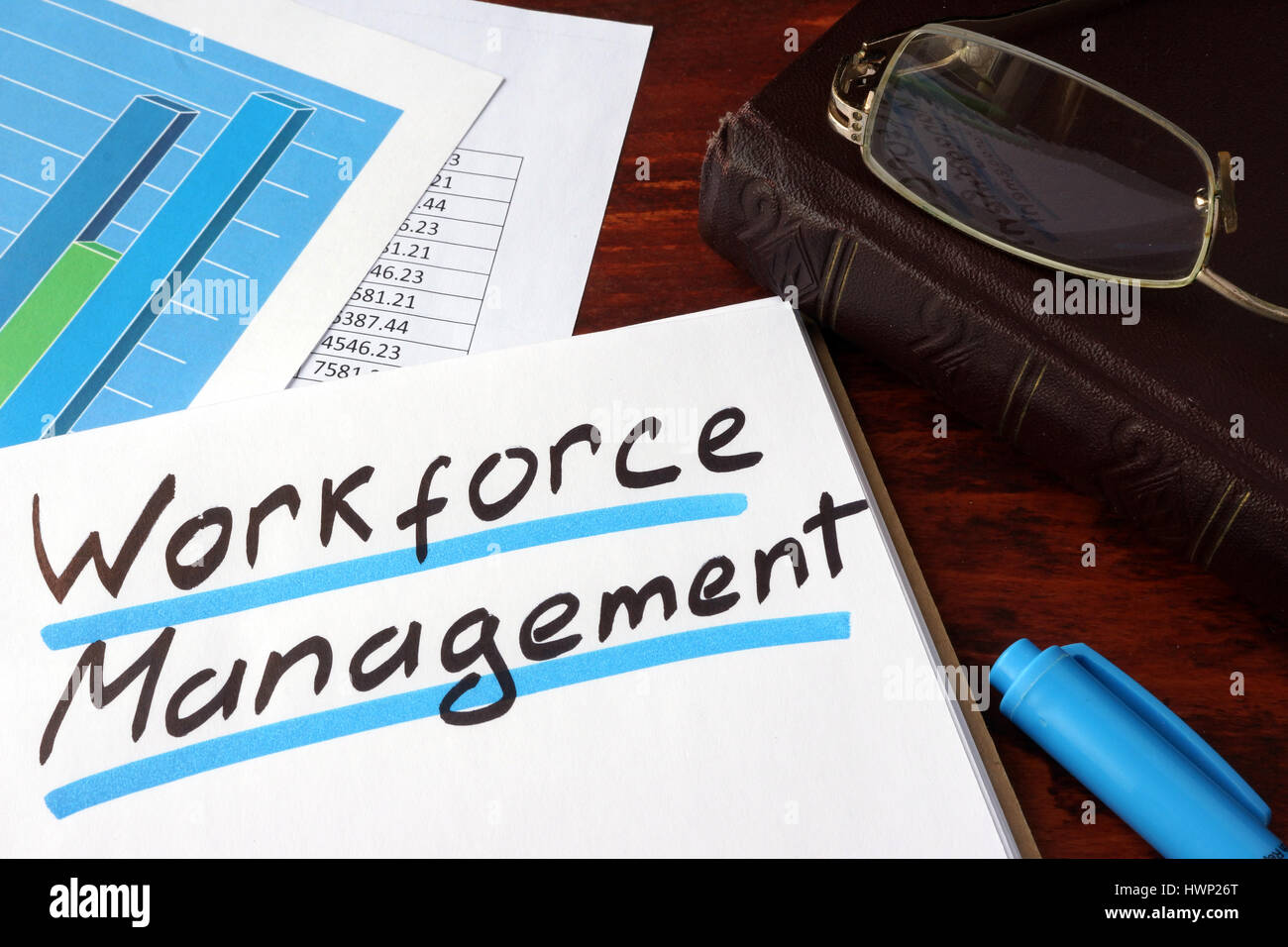 Workforce management written in a notebook and marker Stock Photo - Alamy