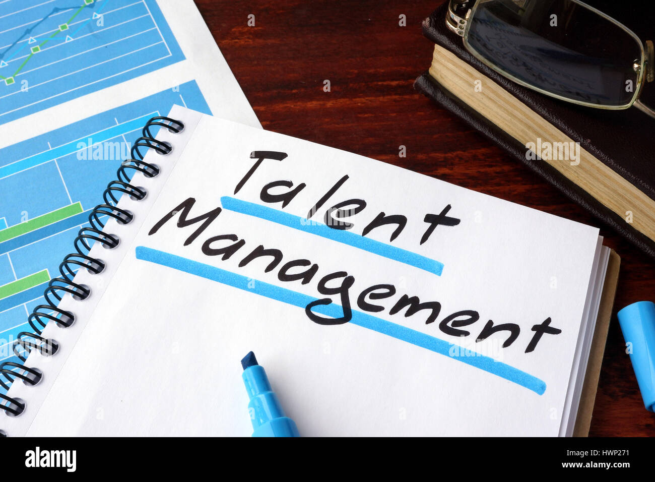 Talent management written in a notebook and marker Stock Photo - Alamy