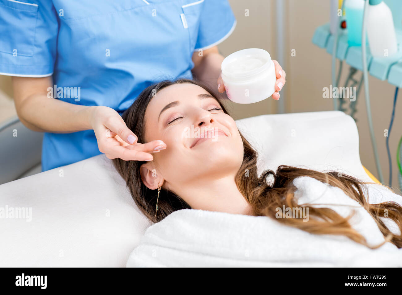 Applying facial cream Stock Photo - Alamy