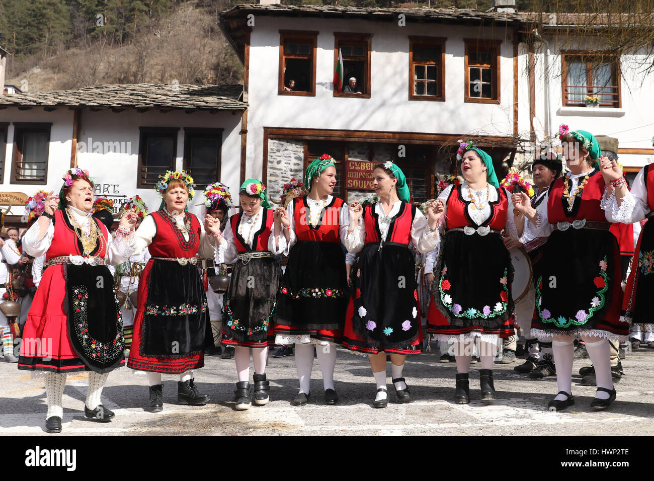 People in traditional costumes dance bulgarian horo in village Shiroka ...