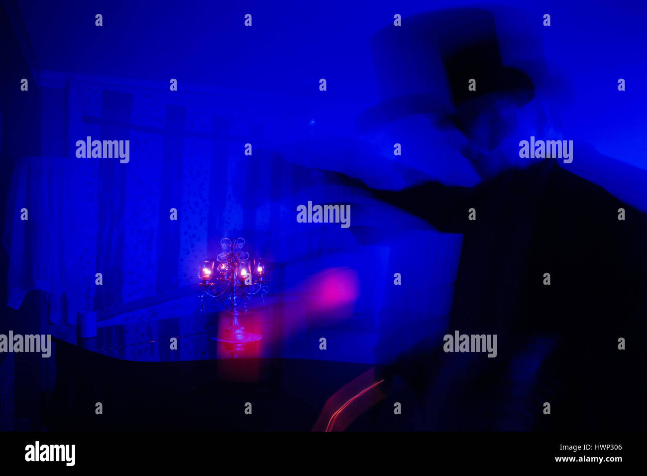 costume men with a lantern in blue lighting Stock Photo - Alamy