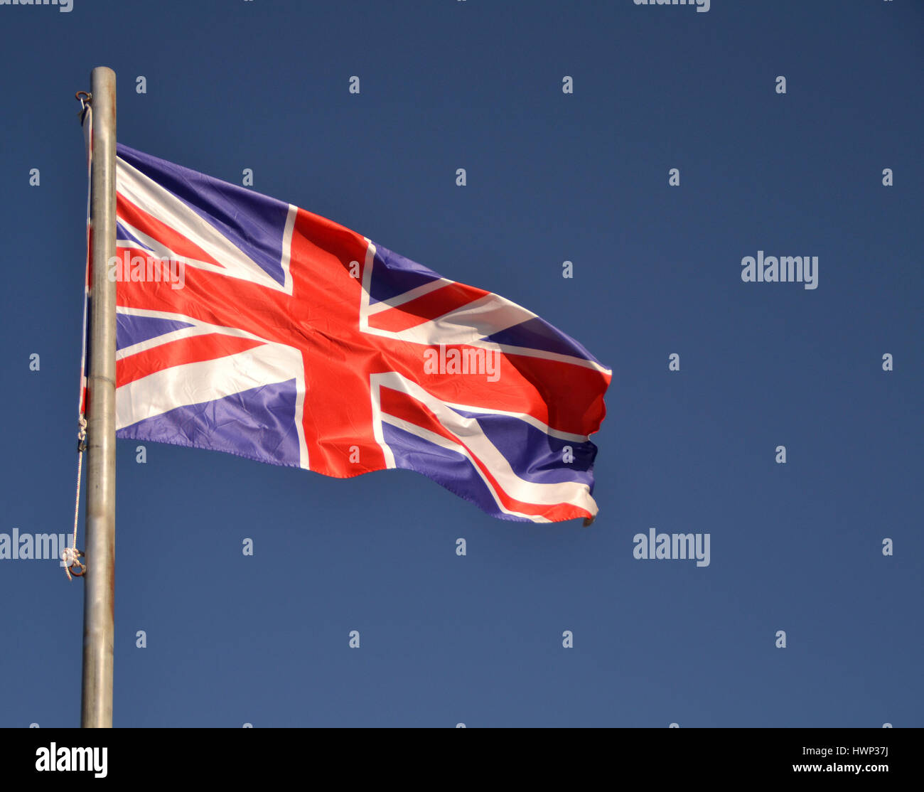 View of United Kingdom flag waving Stock Photo - Alamy