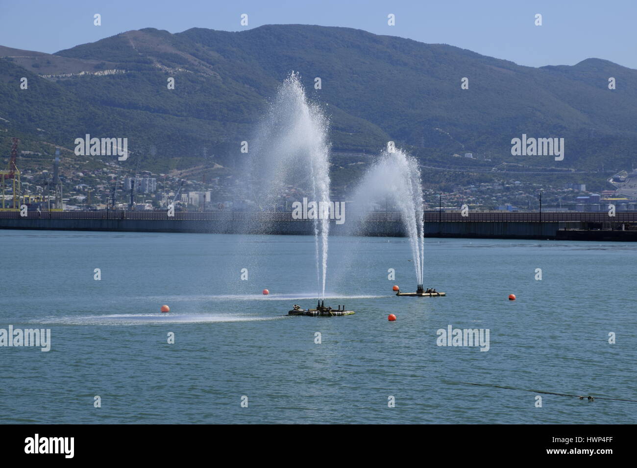 Fountains in the sea. Spray fountains in the bay. Sea port Stock Photo ...