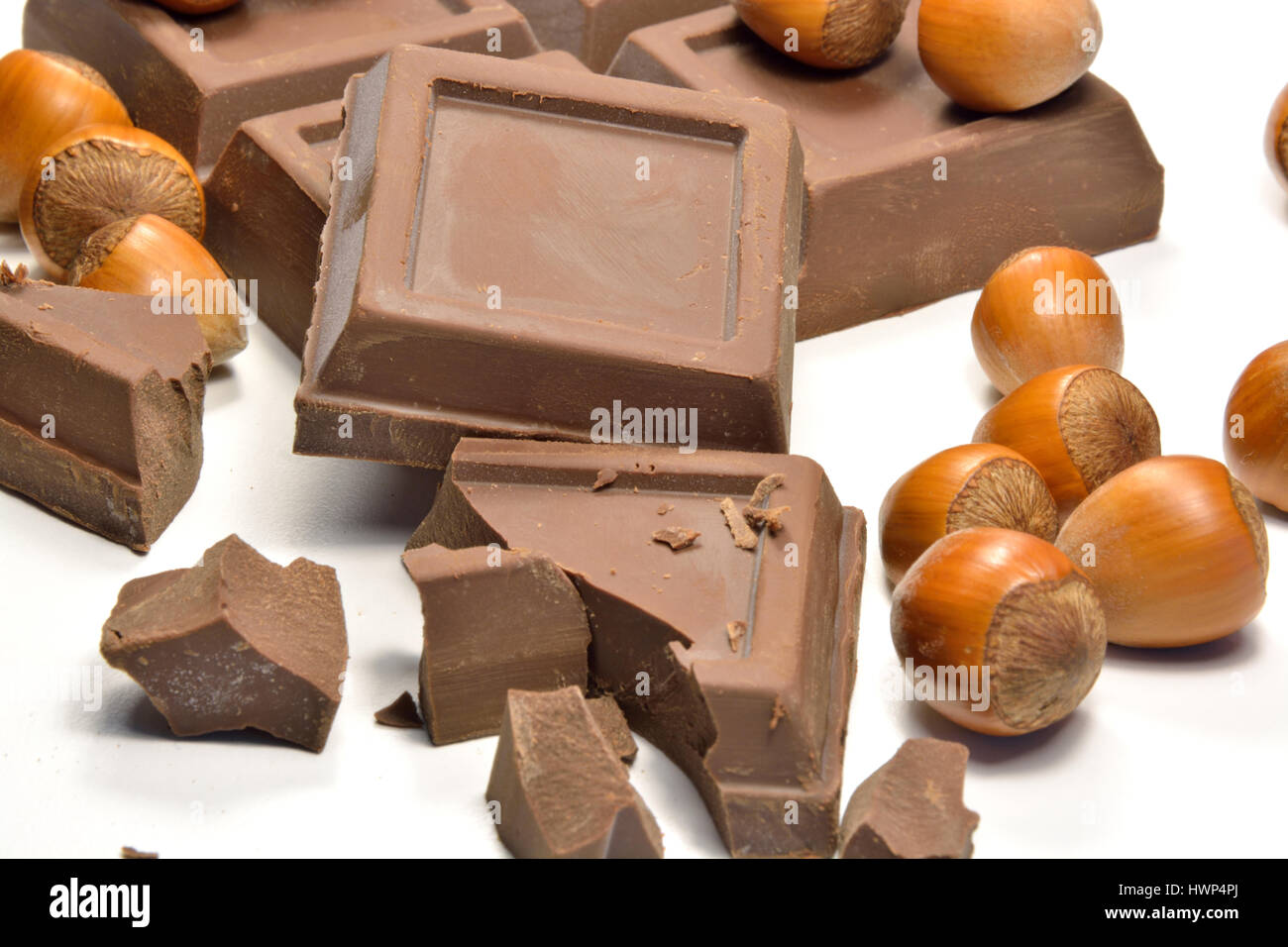 Chocolate and hazelnuts isolated on white background Stock Photo - Alamy