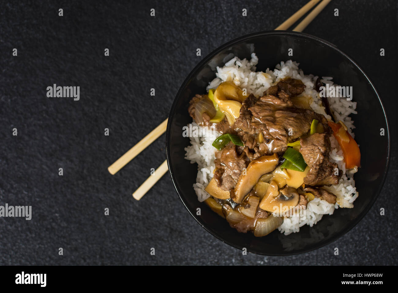 Chinese rice with beef meat and vegetagles on dark background Stock ...