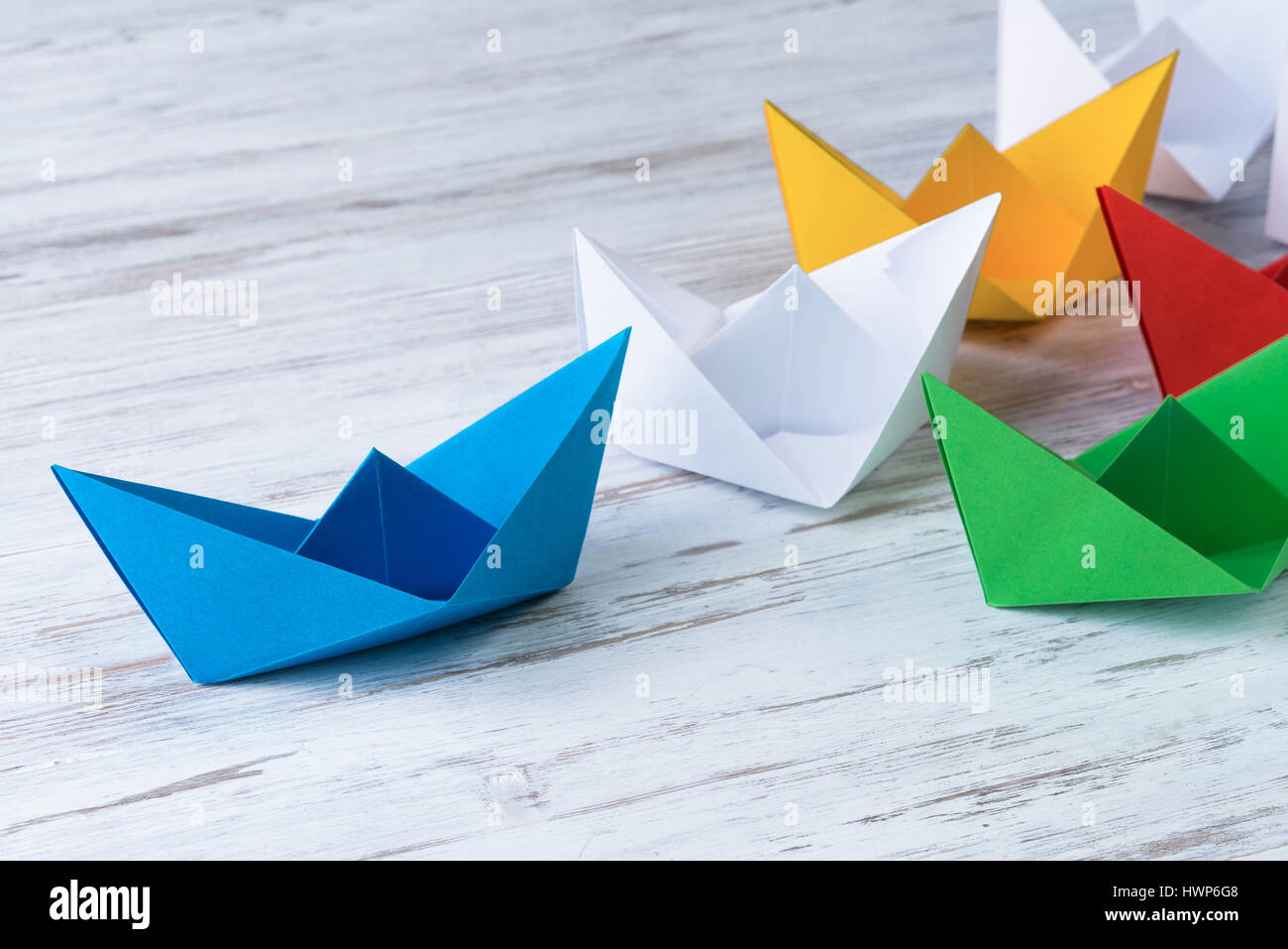 Business leadership concept with white and color paper boats on Stock ...