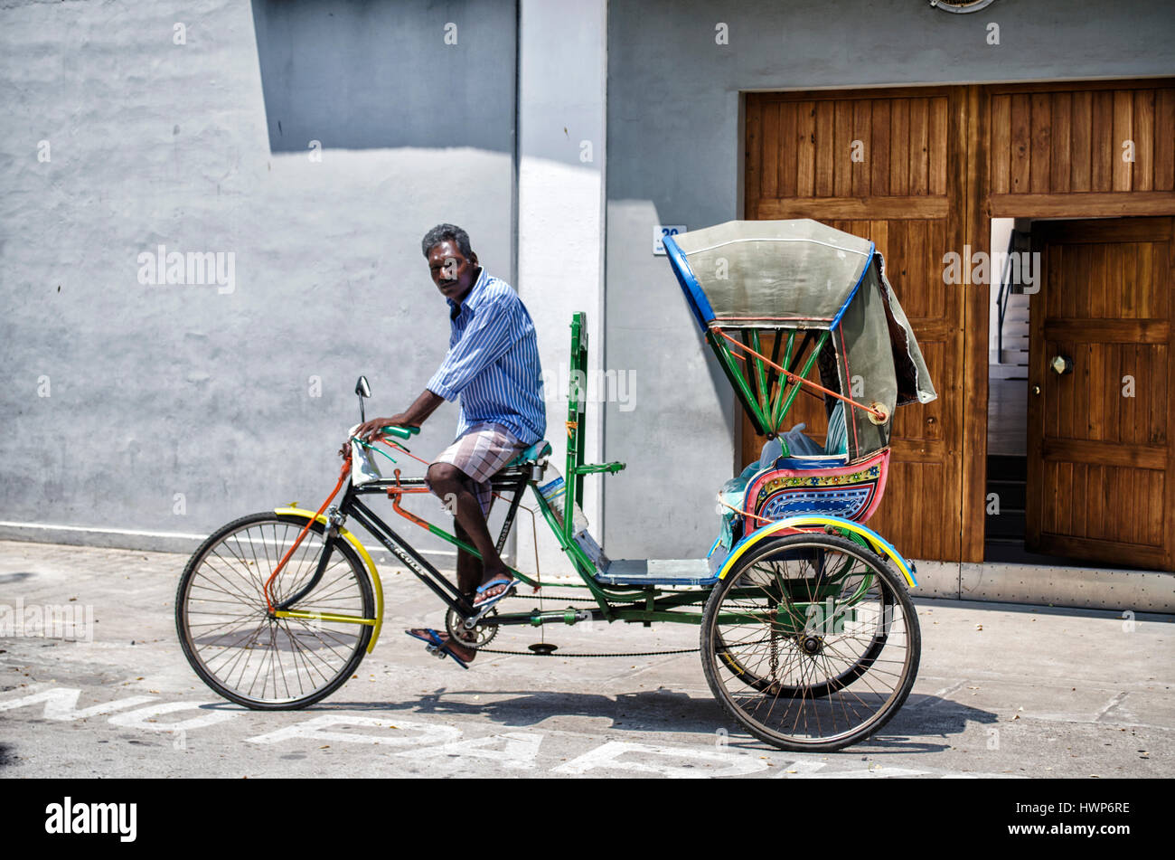 Rickshaw man waiting for tourist on the street of Pondicherry Stock ...