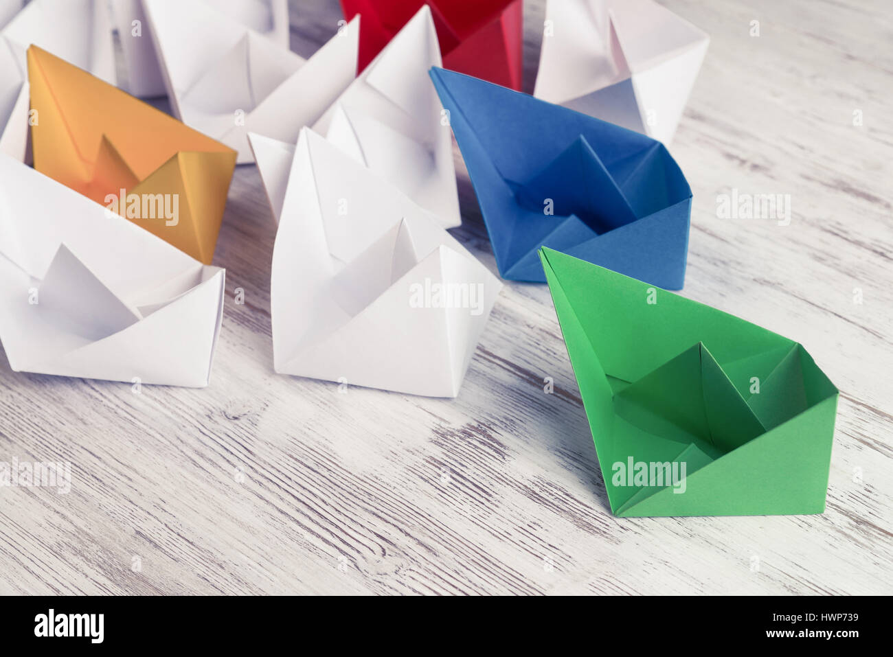 Business leadership concept with white and color paper boats on Stock ...