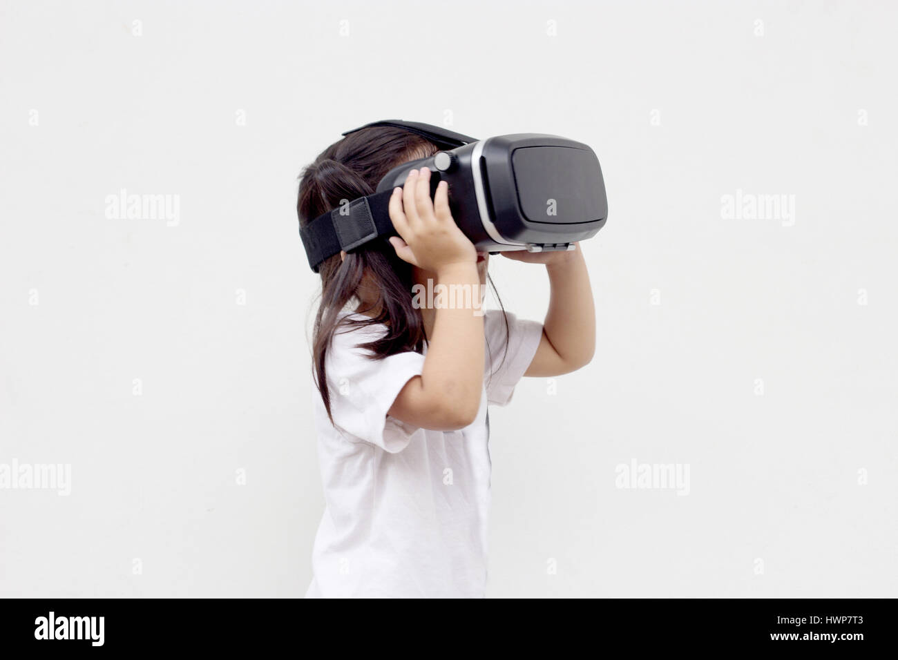 asian girl play VR box on eye on white background Stock Photo - Alamy