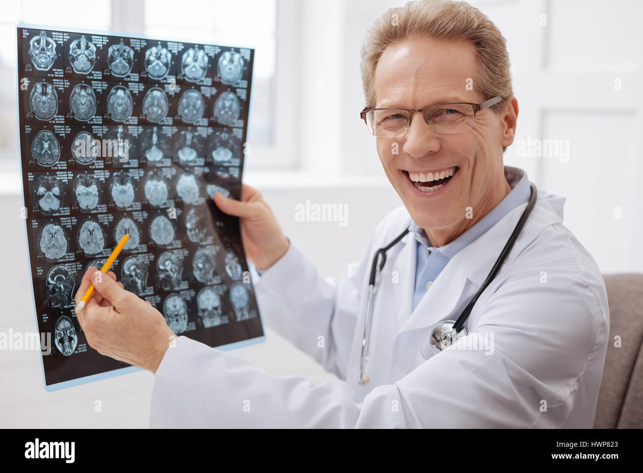 Clean and healthy. Handsome cheerful professional surgeon looking ...