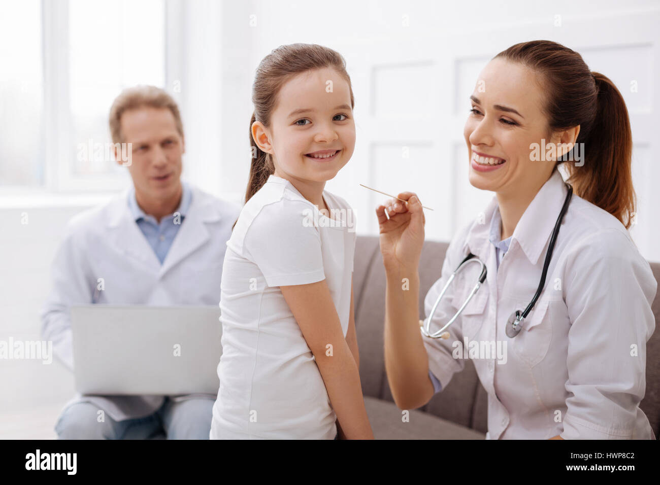 Regular visit. Pretty smiling cute child being completely unafraid of ...