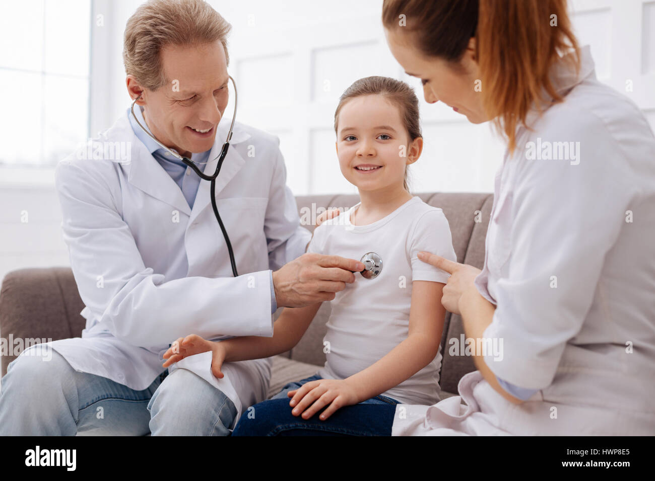 All attention is yours. Prominent gentle charming doctor running a ...